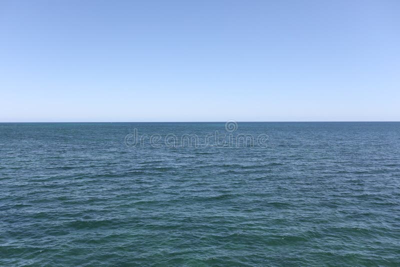Beautiful Shot of a Smooth Sea on a Clear Sky Background Stock Photo ...