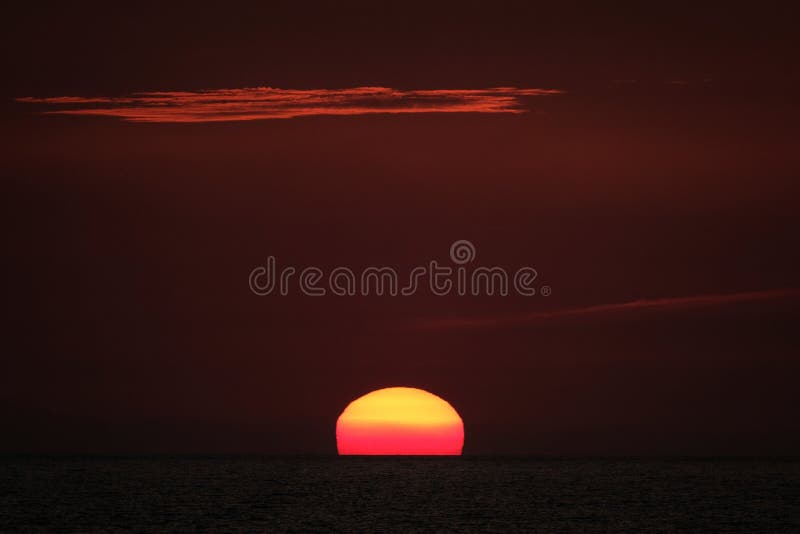 Beautiful Shot of the Sun Going Down in a Red Sky Stock Photo - Image ...