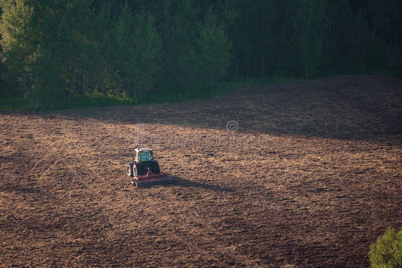 Beautiful Shot of a Tractor in a Field Stock Photo - Image of landscape ...