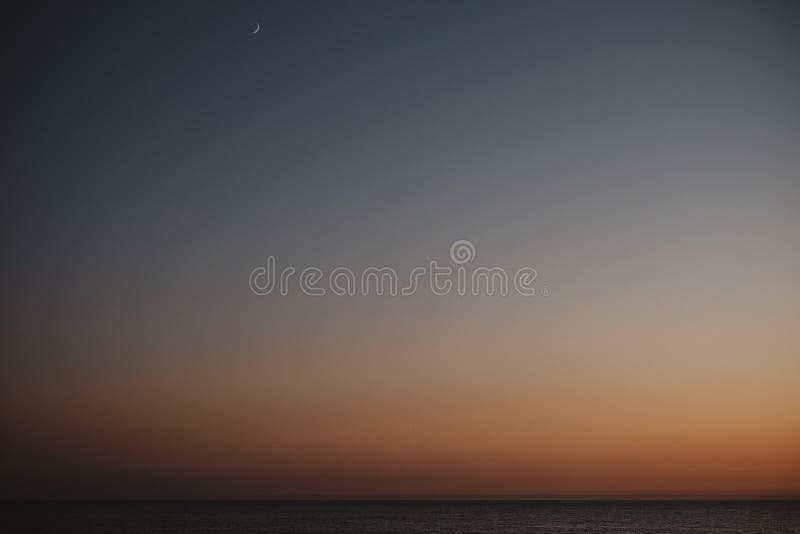 Beautiful Shot of a Twilight Gradient Sky with a Crescent Moon Above ...