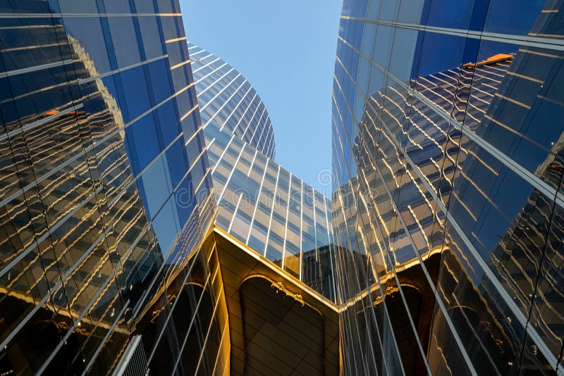 Beautiful Shot of Two Building Connected with a Bridge and Reflecting ...