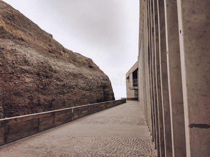 Beautiful Shot of a Walking Path between a Cliff and a Building Stock ...