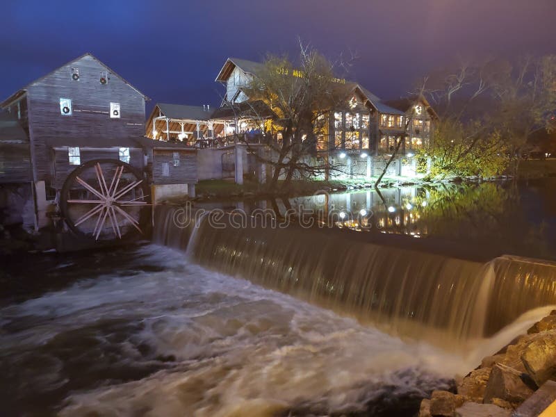 Beautiful Shot of a Waterfall Next To a Watermill Building Stock Image ...