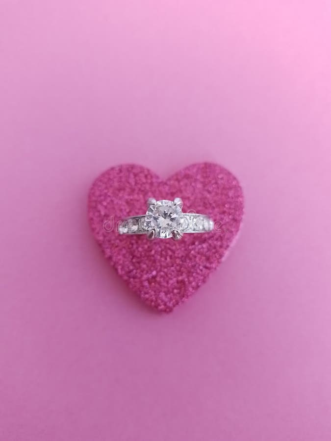 Beautiful Silver Diamond Engagement Ring on a Pink Heart on a Pink ...