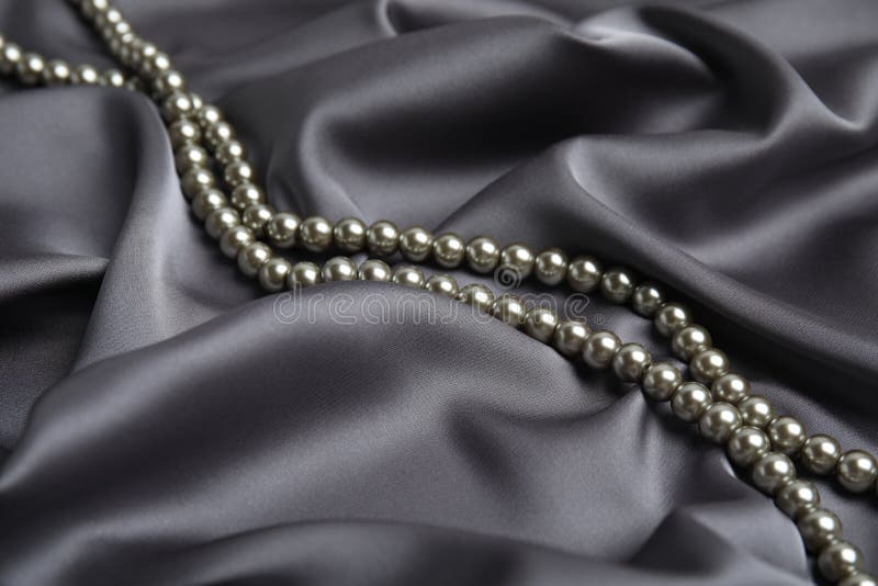 Beautiful Silver Pearls on Delicate Grey Silk Stock Photo - Image of ...