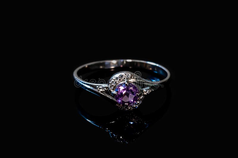 Beautiful Silver Ring with Purple Gemstone Isolated on Black Background ...