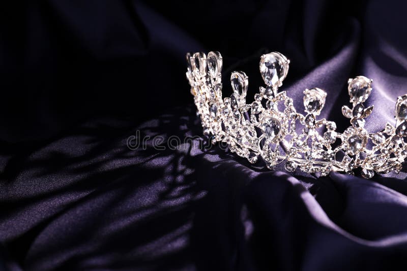 Beautiful Silver Tiara with Diamonds on Dark Cloth. Space for Text ...