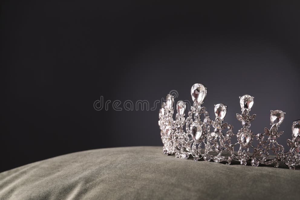 Beautiful Silver Tiara with Diamonds on Grey Cloth. Space for Text ...