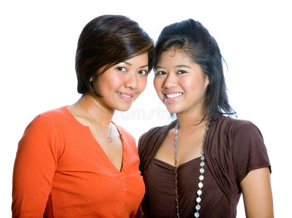 Beautiful Sisters in Orange and Brown Top. Stock Photo - Image of ...