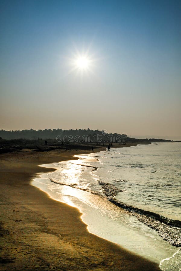 Colorful Ocean Beach Sunrise with Deep Blue Sky and Sun Rays. Stock ...