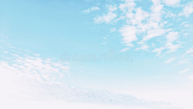 A Beautiful Sky with Fluffy Clouds Floating on a Calm Blue Background ...