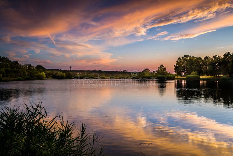 Sunset at the pond stock image. Image of horizon, lake - 120217377
