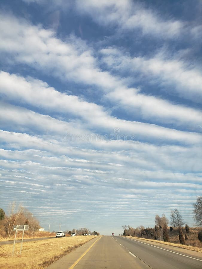 A Beautiful Sky Inspiring in a Long Drive Rows of Clouds Stock Image ...