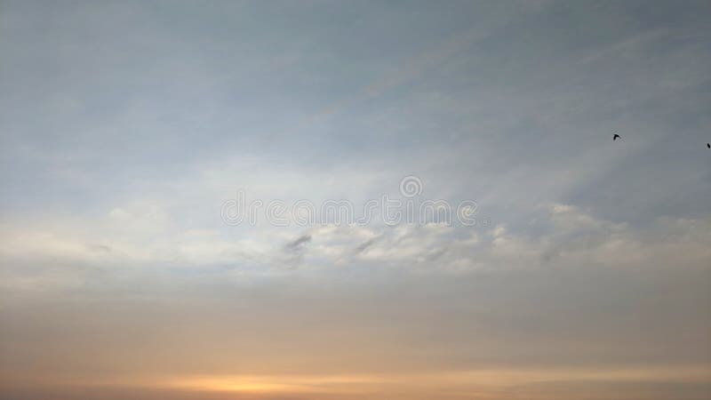 A Beautiful Sky with Shades of Pink, Purple, and Orange. the Clouds are ...