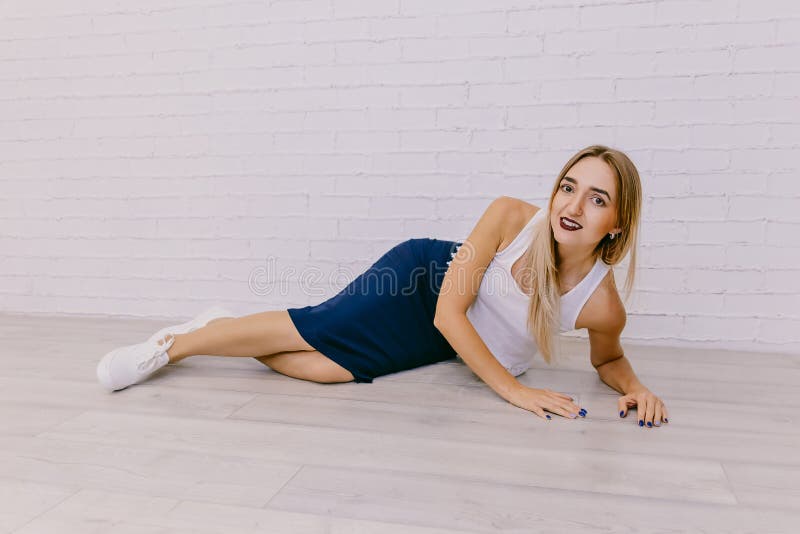 Beautiful Slender Girl on the Floor in Full Length in the Studio Stock ...