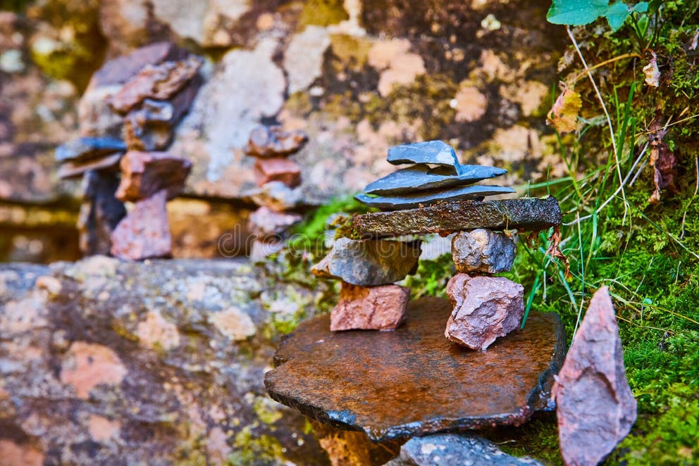 Beautiful Small Stone Stack Cairn Forming Bench Against Lichen Rocks ...