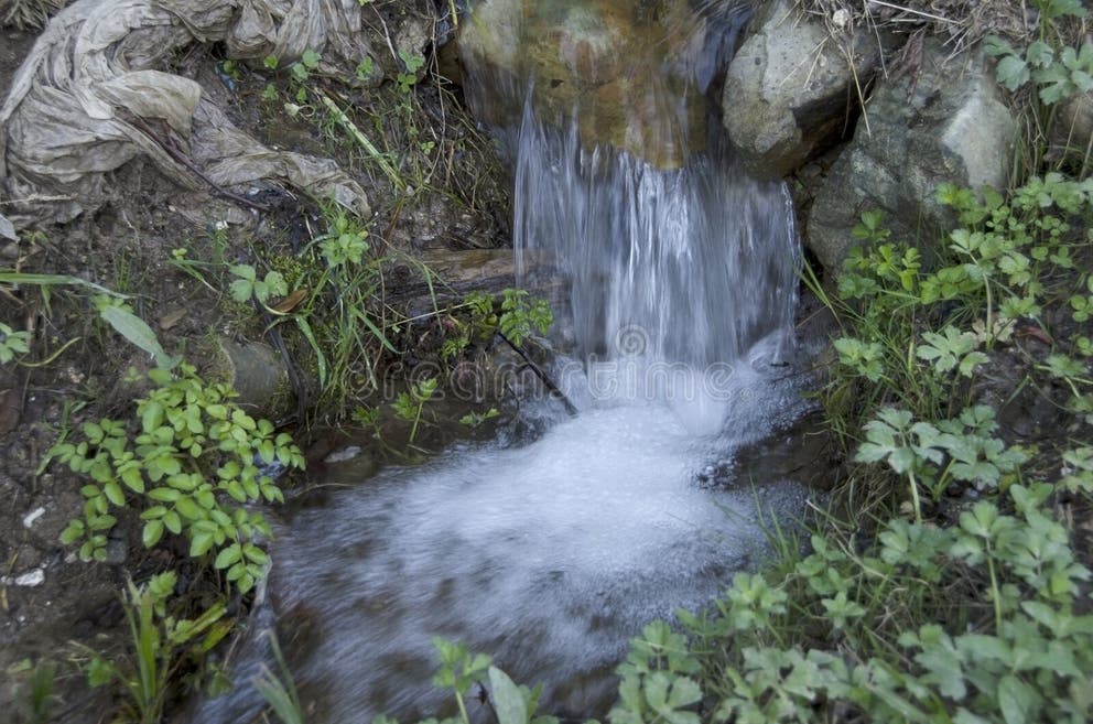 Beautiful Small Waterfall in the Forest Polluted with Plastic Bags and ...