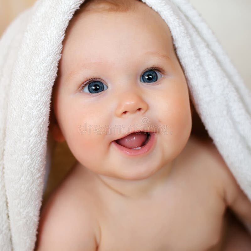 A Beautiful Smiling Baby Wrapped in Quilt Stock Image - Image of baby ...