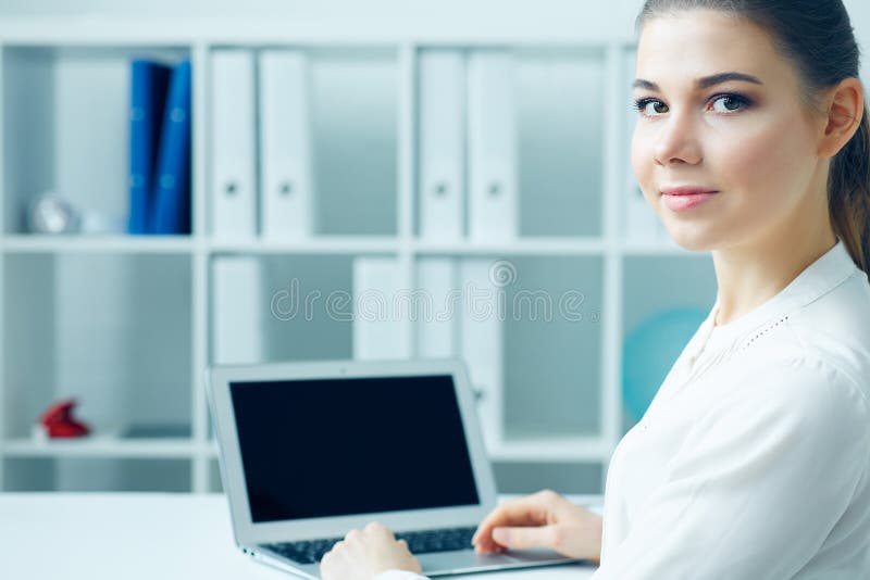Beautiful Smiling Business Woman Sitting at Office Workplace Half Turn ... Beautiful Smiling Business Woman Sitting at Office Workplace Half Turn ...