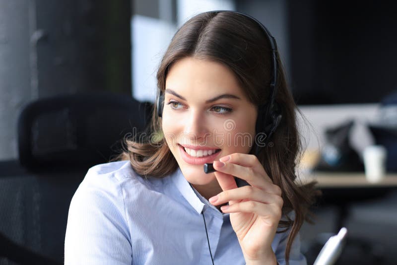 Beautiful Smiling Call Center Worker in Headphones is Working at Modern ...