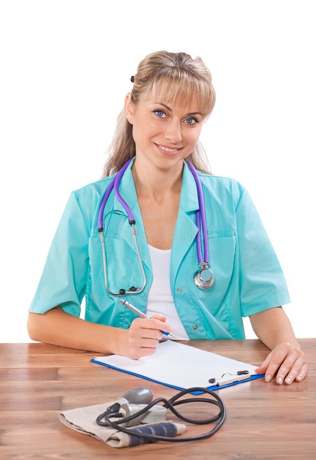 Beautiful Smiling Female Doctor Sitting at the Table Writing and Stock ...