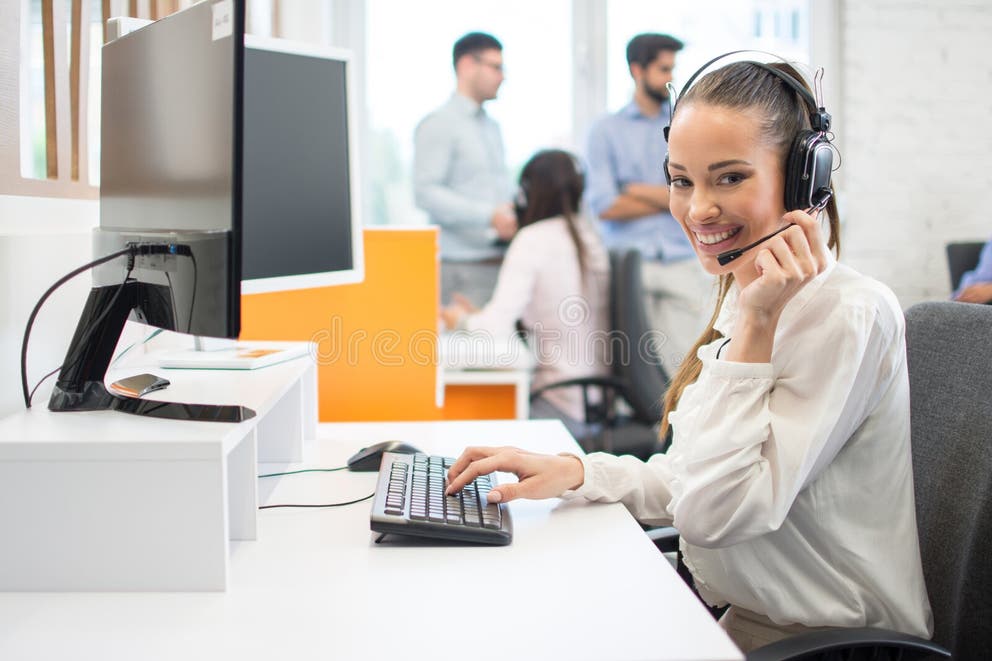 Beautiful Smiling Female Technical Support Worker Working on Computer ...