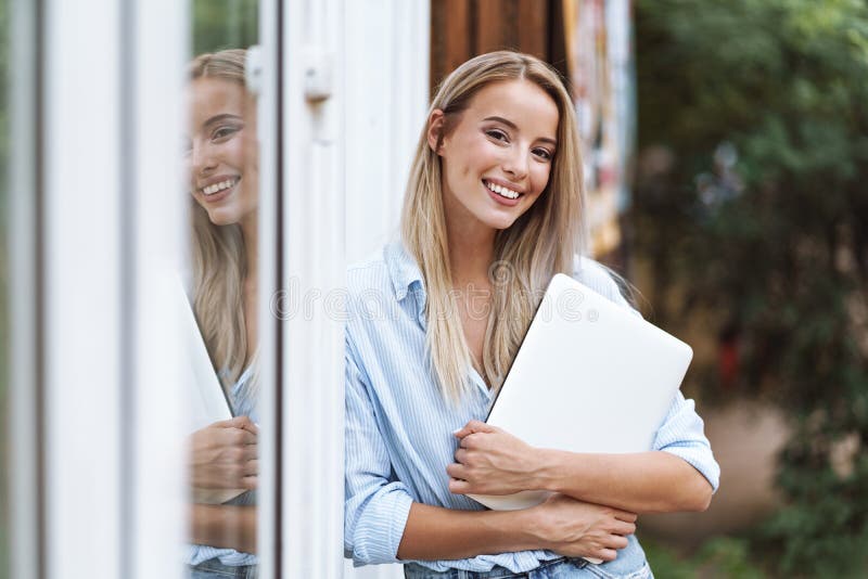 Beautiful Smiling Girl Holding Laptop Computer Stock Photo - Image of ...