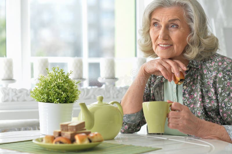 Beautiful Smiling Senior Woman Drinking Tea Stock Photo - Image of ...