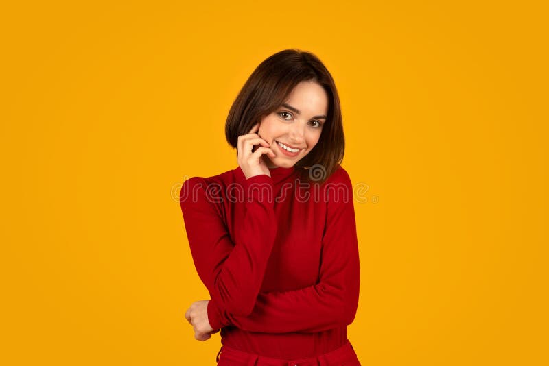 Beautiful Smiling Young Woman Touching Her Face Looking At Camera Stock