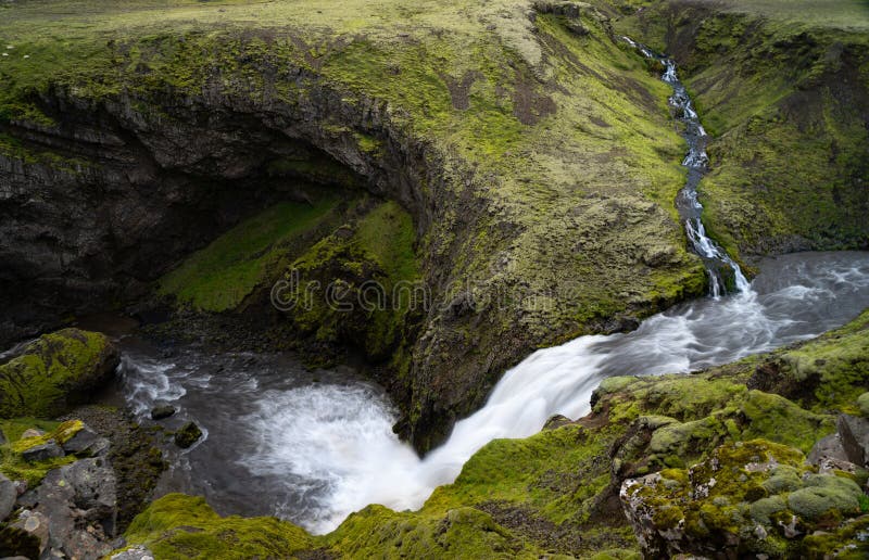 Beautiful Smooth Waterfall in Iceland Surrounded by Green Hills Stock ...