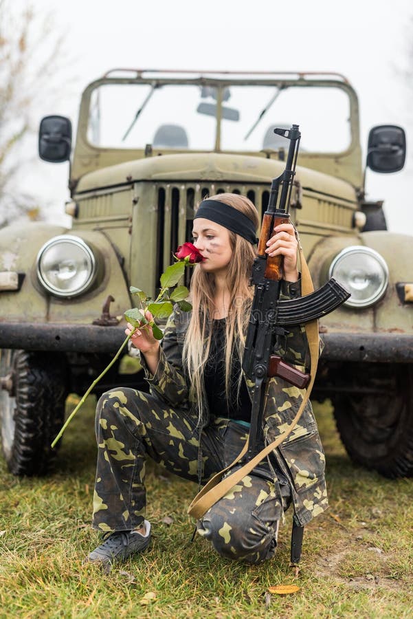 Beautiful Soldier with Rose Flower and Rifle Stock Photo - Image of ...