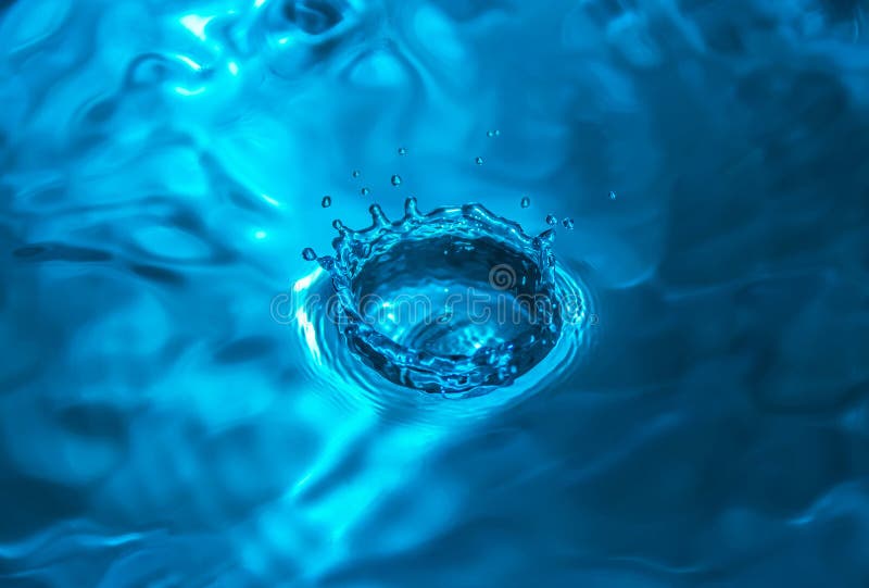 Beautiful Splashing Water Drop in Blue Color Stock Photo - Image of ...