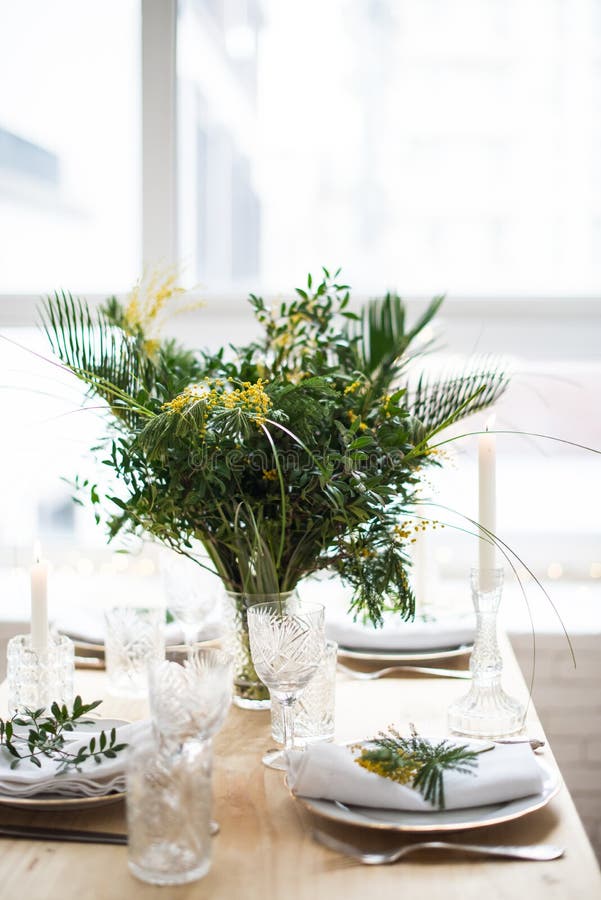 Beautiful Springtime Table Setting with Green Leaves and Mimosa ...