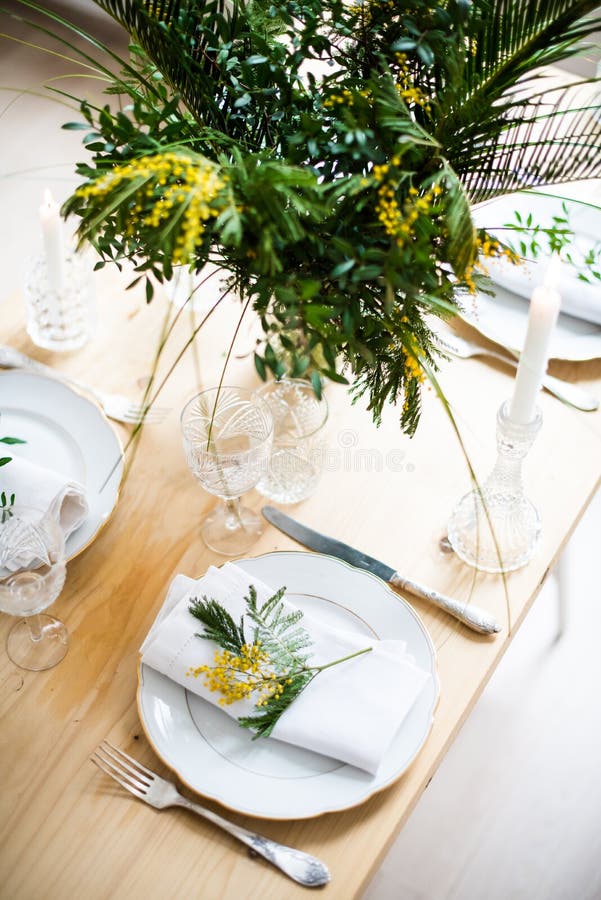 Beautiful Springtime Table Setting with Green Leaves and Mimosa ...