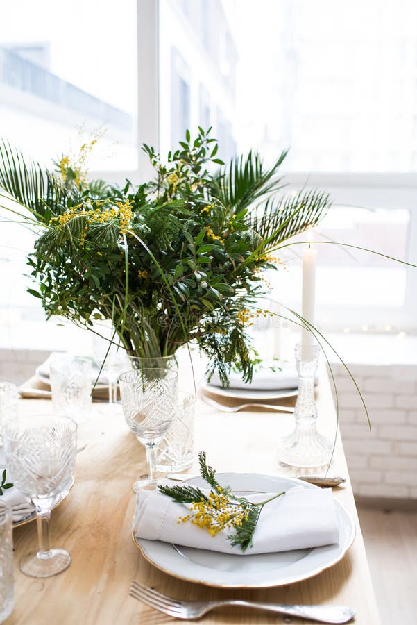 Beautiful Springtime Table Setting with Green Leaves and Mimosa ...