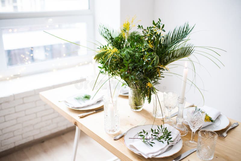 Beautiful Springtime Table Setting with Green Leaves and Mimosa ...