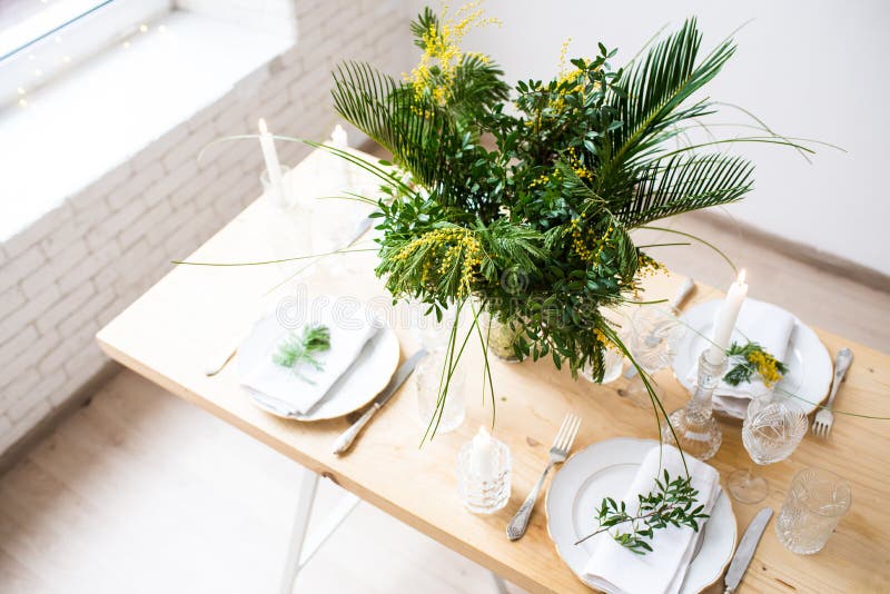 Beautiful Springtime Table Setting with Green Leaves and Mimosa ...
