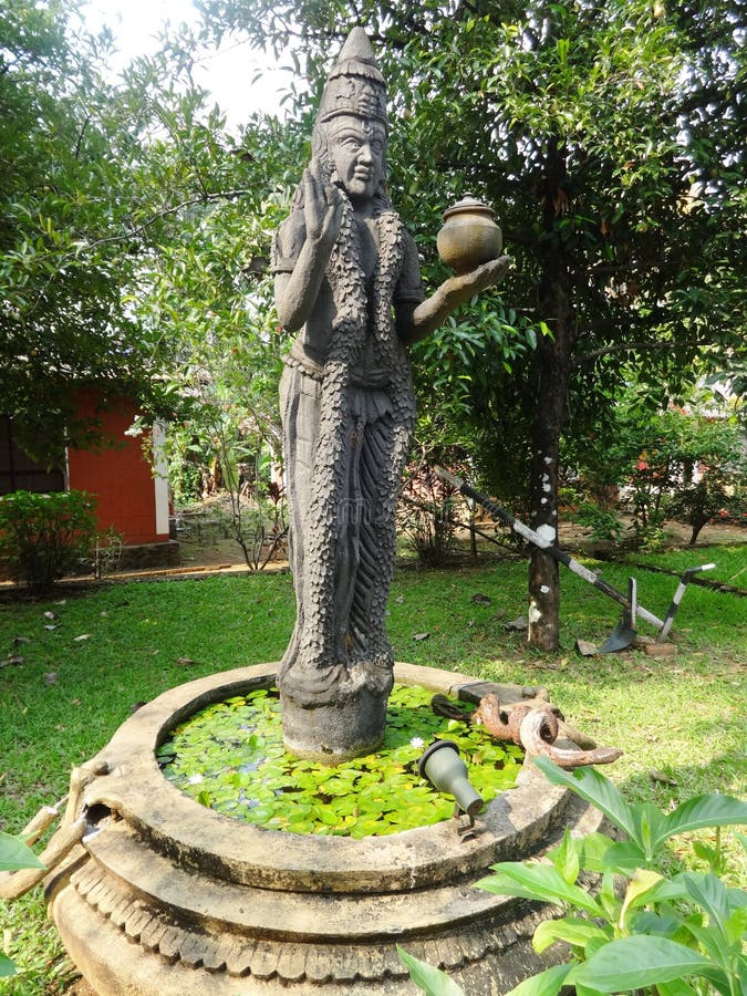 A Beautiful Statue in a Garden Stock Photo - Image of giving, antique ...