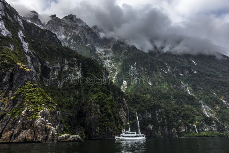 Beautiful Steep Cliff and Boat on a Surface Stock Photo - Image of ...