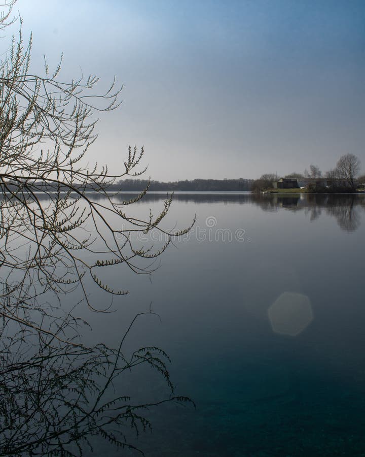 Beautiful Still Lake with Branches in the Foreground with Hexagonal ...