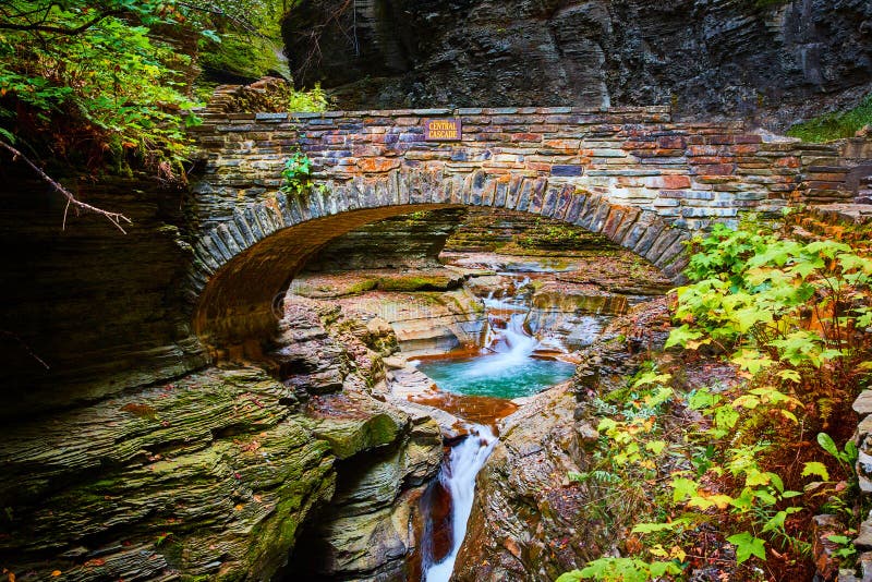 Beautiful Stone Arch Walking Bridge Over Gorge and River with Blue ...