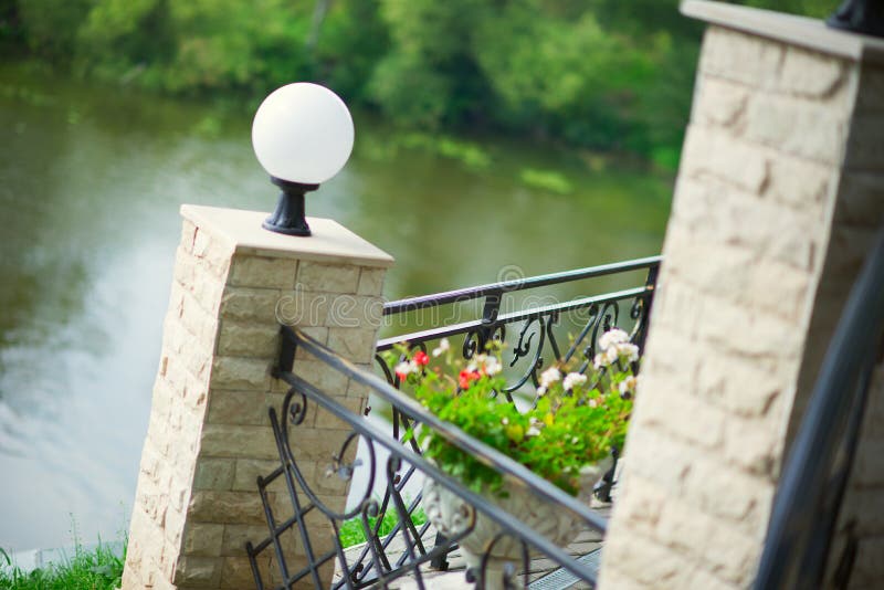 Beautiful Stone Fence with with Posts and Lamps in Parks. Stock Image ...