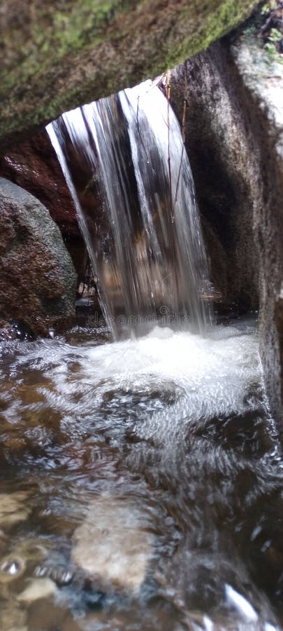 Beautiful Stream with a Waterfall the Light Shining through Stock Photo ...