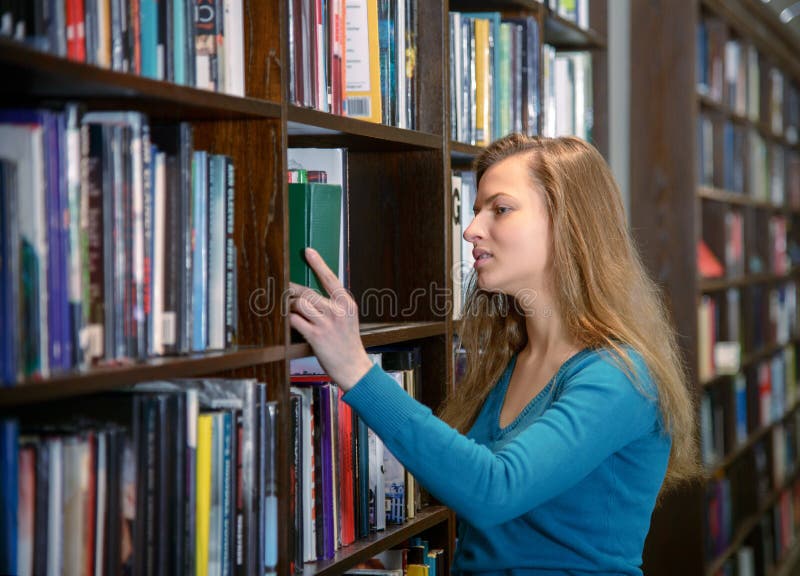 Beautiful Student Girl in a Library Stock Photo - Image of book, modern ...