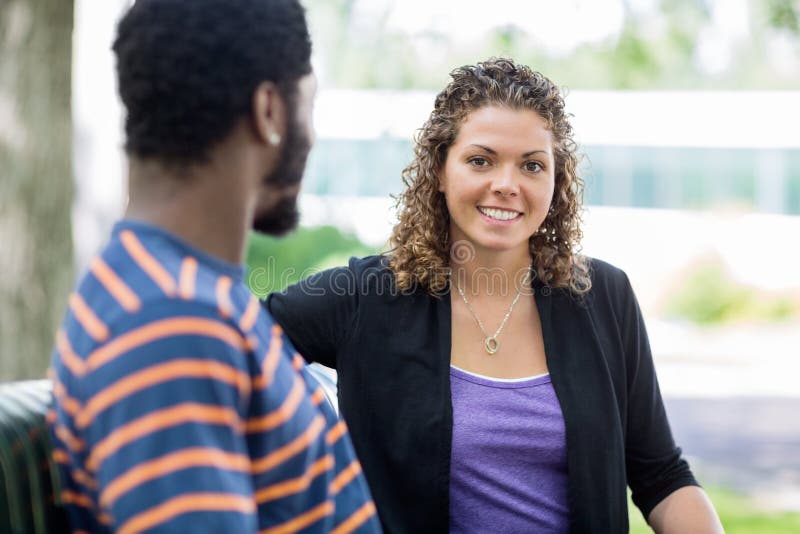 Beautiful Student Sitting with Classmate on Campus Stock Image - Image ...