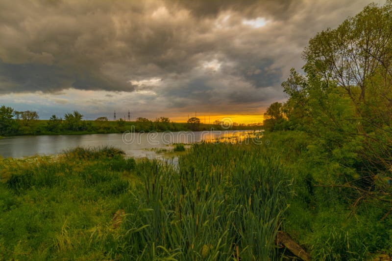 Beautiful Summer Landscape.Bright Purple Clouds Over the Surface of ...
