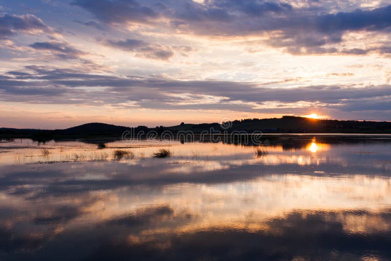 Beautiful Summer Sunset with Cloudy Sky and Setting Sun on the River ...
