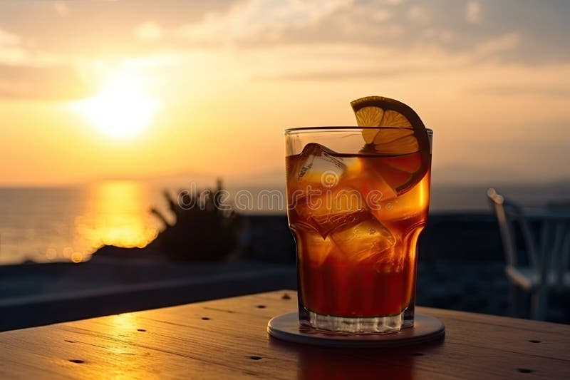 Beautiful Summer Sunset with Glass of Iced Tea and Slice of Lemon Stock ...