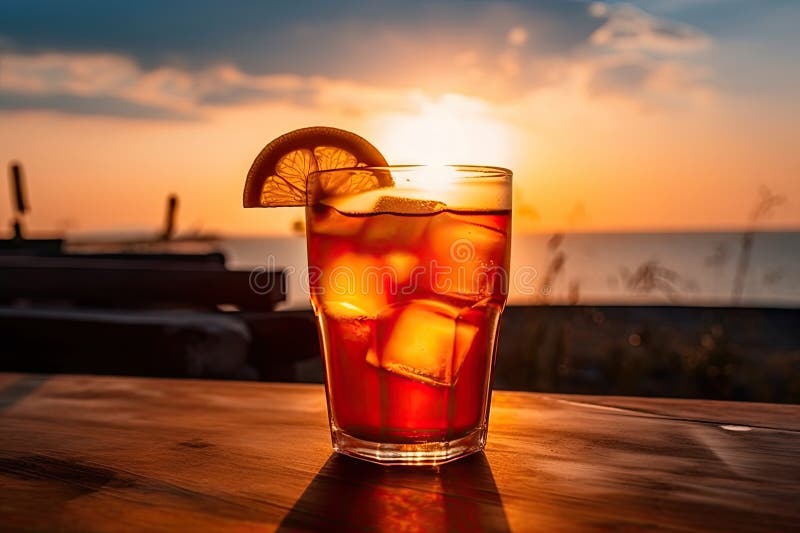 Beautiful Summer Sunset with Glass of Iced Tea and Slice of Lemon Stock ...