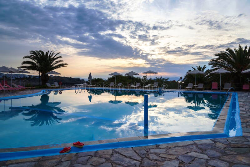 Sunset and swimming pool stock photo. Image of sand, paradise - 4164704